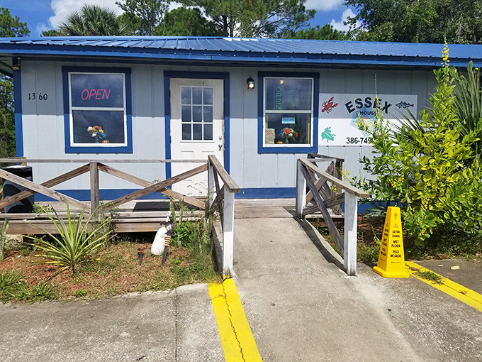 A slice of New England in the Sunshine State! Essex Seafood House's blue-trimmed exterior promises a seafood adventure that'll make you forget you're in Florida.