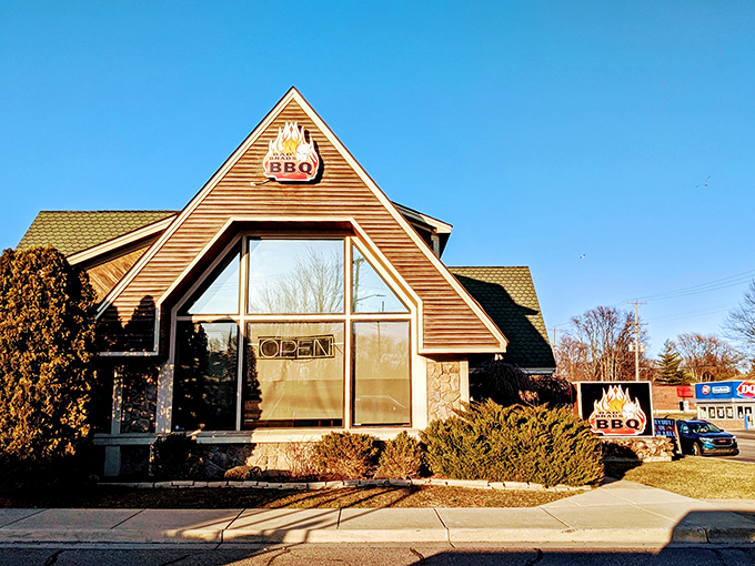 A rustic cabin or a BBQ paradise? At Bad Brad's, it's both! This charming exterior promises smoky delights within, like a meaty oasis in suburban Michigan.