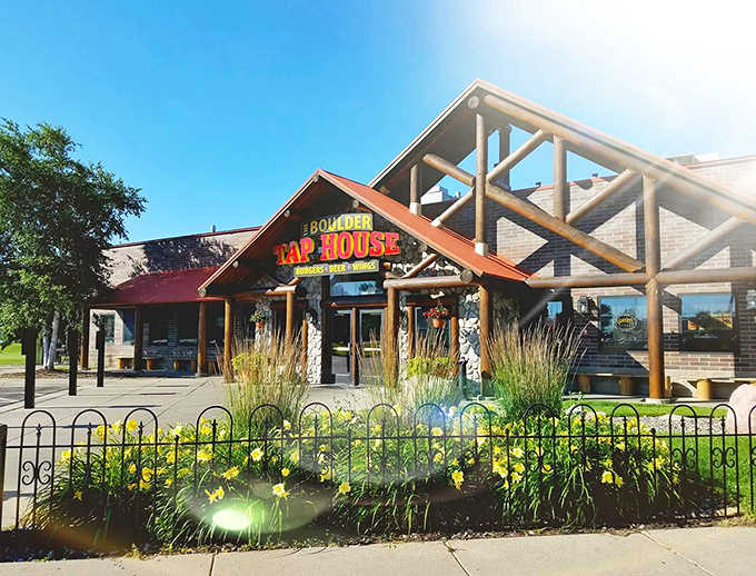 Welcome to Boulder Tap House, where rustic charm meets modern comfort food cravings. This inviting exterior promises a feast for both eyes and taste buds!
