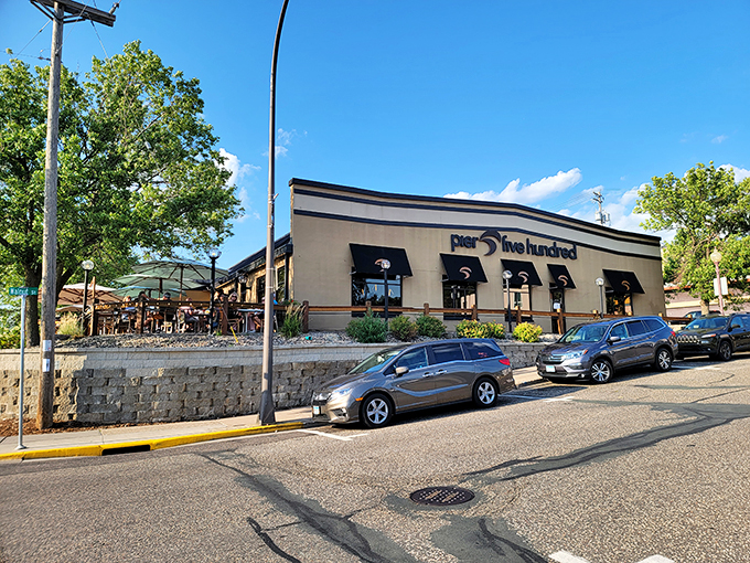Welcome to Pier 500, where the entrance is as inviting as a warm Wisconsin hug. Flower-filled planters and stone accents beckon you into this riverside gem.