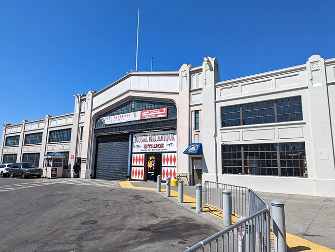 Step right up, folks! The Mus&eacute;e M&eacute;canique's entrance is like a portal to a bygone era of entertainment. Red diamonds and vintage lettering promise a world of mechanical wonders waiting inside.