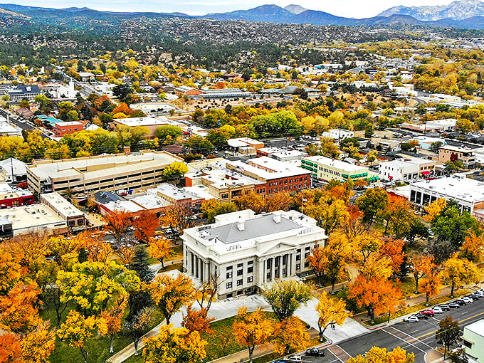 Prescott's autumn splendor unfolds in a vibrant tapestry of gold and crimson, embracing the town's charming architecture.