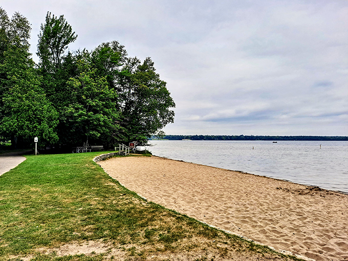 Nature's welcome mat: A sandy shore meets lush greenery, inviting you to kick off your shoes and stay awhile. Who needs a red carpet when you've got this golden beach?