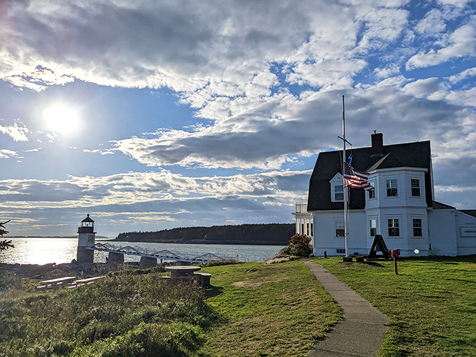 A postcard come to life: Marshall Point Lighthouse stands sentinel against a dramatic sky, its white tower a beacon of maritime history and Instagram-worthy views.