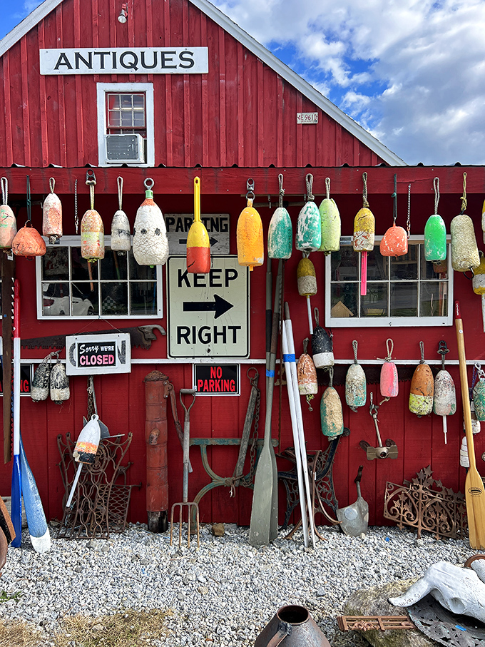 A treasure hunter's paradise! This vibrant red barn isn't just a building; it's a portal to the past, bursting with colorful buoys and vintage charm.