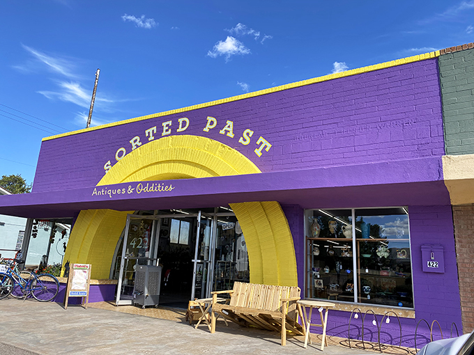 A purple and yellow oasis in the desert! This vibrant storefront is like stumbling upon Willy Wonka's Antique Factory.