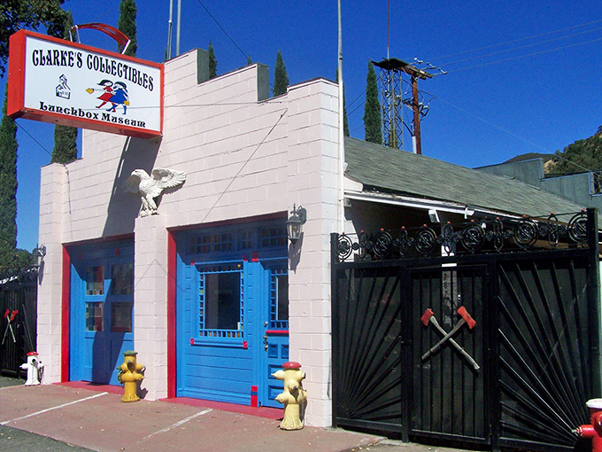 Welcome to the time machine! Clarke's Collectibles stands proud, its blue door a portal to childhood dreams guarded by whimsical fire hydrants.