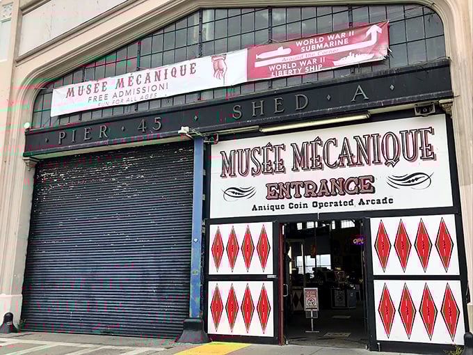 Step right up, folks! The Mus&eacute;e M&eacute;canique's entrance is like a portal to a bygone era of entertainment. Red diamonds and vintage lettering promise a world of mechanical wonders waiting inside.
