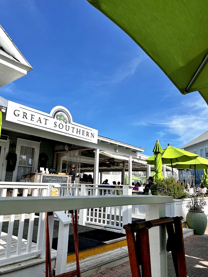 Welcome to flavor paradise! The Great Southern Cafe's charming exterior promises a feast for the senses, with those lime-green umbrellas practically winking at you to come on in.