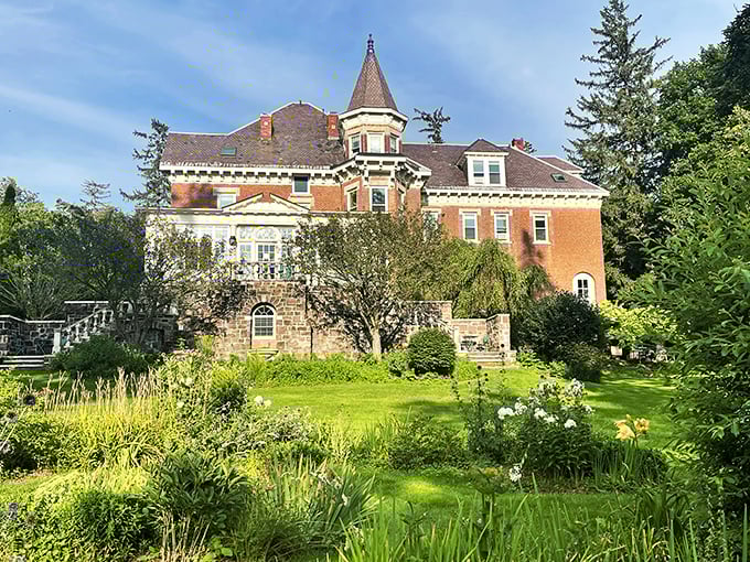 A Victorian dream come to life! This architectural masterpiece looks like it jumped straight out of a Wes Anderson film, but with more maple syrup.
