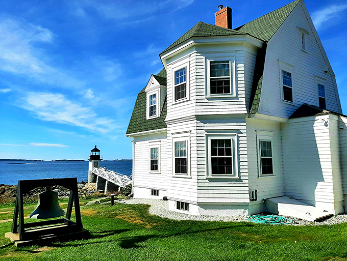 A postcard come to life: Marshall Point Lighthouse stands sentinel against a dramatic sky, its white tower a beacon of maritime history and Instagram-worthy views.
