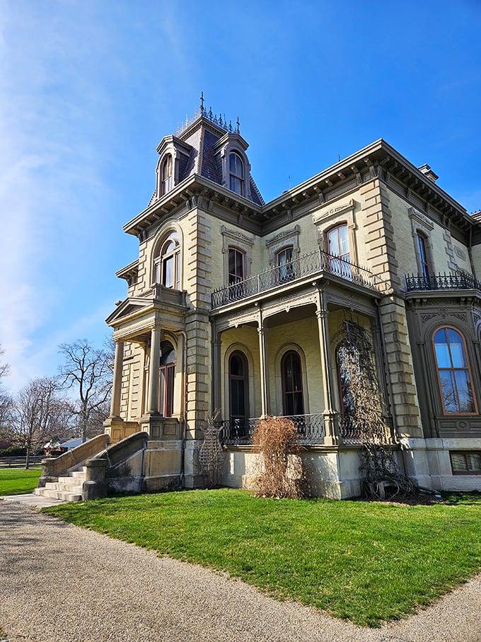 Behold, the architectural equivalent of a Victorian power suit! This brick beauty stands tall, daring you to step into its time-warping embrace.