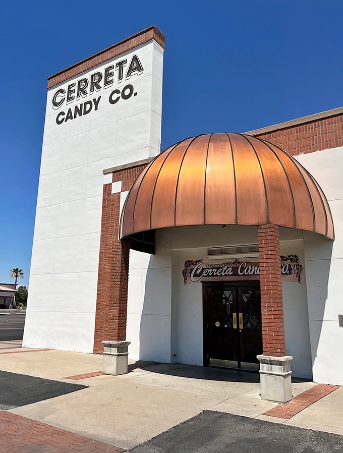 Welcome to candy paradise! Cerreta Candy Company's copper-domed entrance beckons like a sweet siren call, promising sugary delights within its unassuming brick walls.