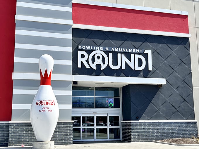 "Welcome to the mothership of fun! Round1's exterior promises a world of excitement, with that giant bowling pin standing guard like a whimsical sentinel."