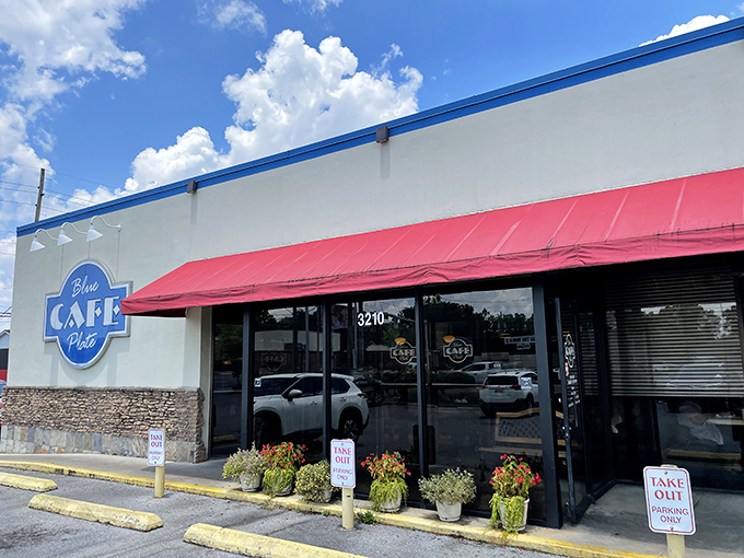 A blue-trimmed beacon of breakfast bliss! This unassuming exterior hides a treasure trove of Southern comfort food that'll make your taste buds dance.
