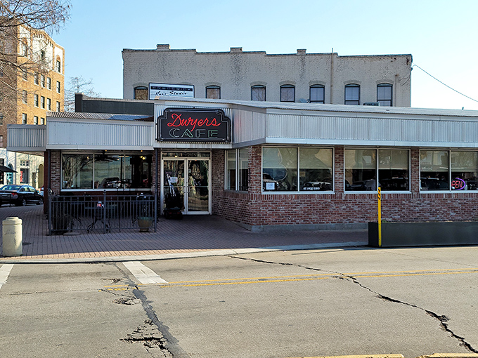 A neon sign that could guide hungry sailors home! Dwyer's Cafe stands proud, a brick-and-mortar beacon of breakfast bliss in downtown Lafayette.