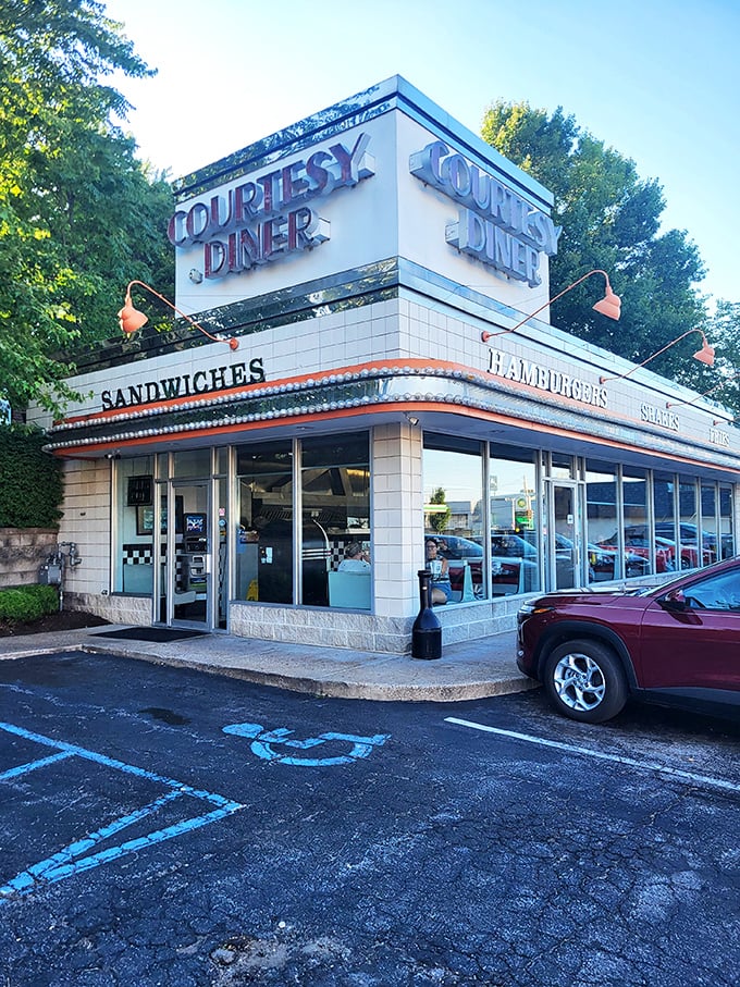 Neon dreams come true! Courtesy Diner's retro sign beckons like a lighthouse for the hungry, promising comfort food and a slice of Americana.