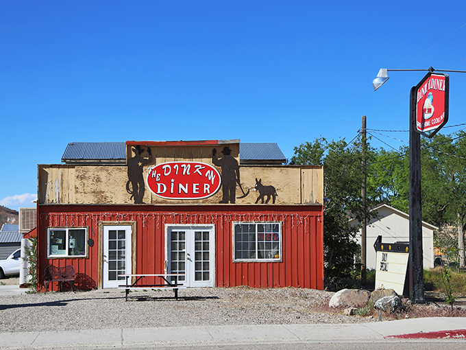 Welcome to the Dinky Diner, where big flavors come in small packages! This charming red exterior is like a beacon of comfort food in the Nevada desert.
