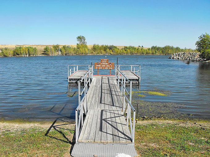 A wooden pier stretches out like an invitation, beckoning you to explore the shimmering waters of Keith Sebelius Reservoir. It's nature's version of a red carpet, minus the paparazzi.