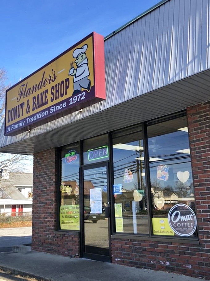 Welcome to donut paradise! Flanders Donut & Bake Shop's cheery yellow sign promises a family tradition of sweet delights since 1972.
