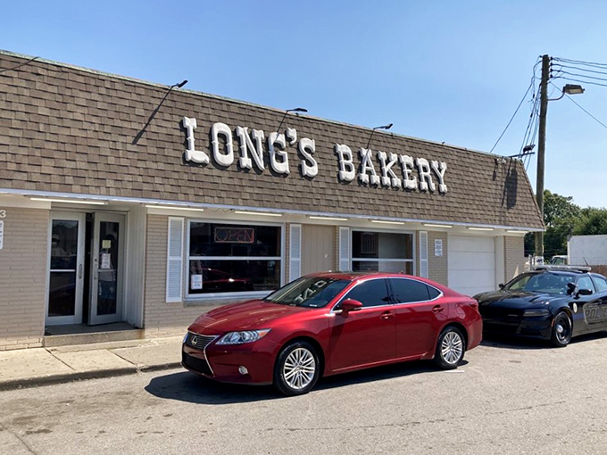 Welcome to donut paradise! Long's Bakery stands proud, its no-frills exterior promising sweet delights within. It's like the Clark Kent of bakeries - unassuming, but hiding superpowers.