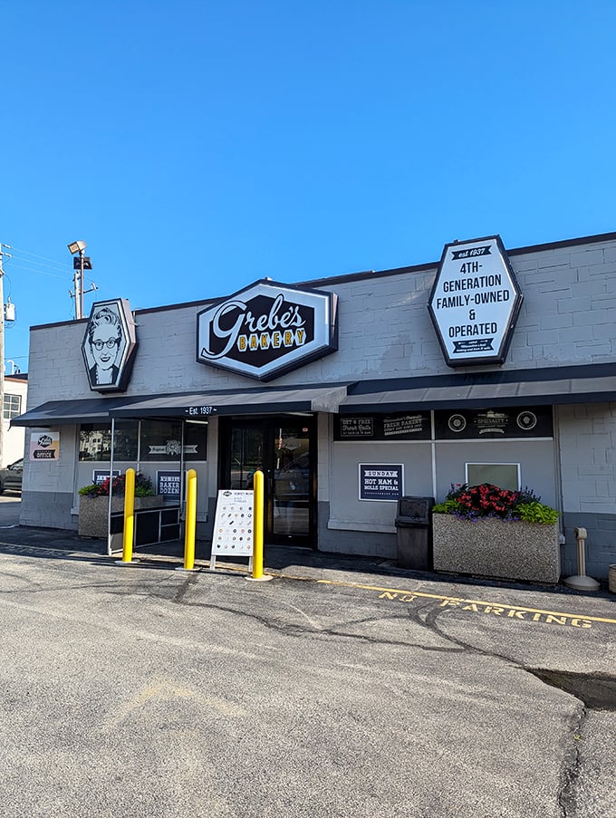 Welcome to carb heaven! Grebe's Bakery's retro sign beckons like a sugary siren, promising delights that would make even the Pillsbury Doughboy jealous.