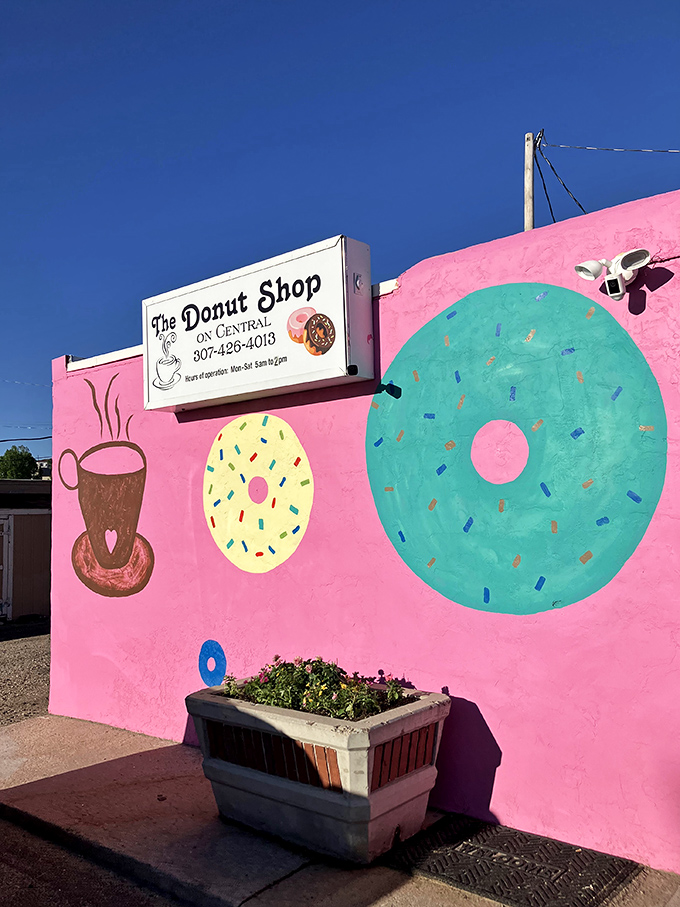 A pink paradise that's more eye-catching than a rodeo clown! This donut shop's exterior is a delightful feast for the eyes and a promise of sweet treats within.