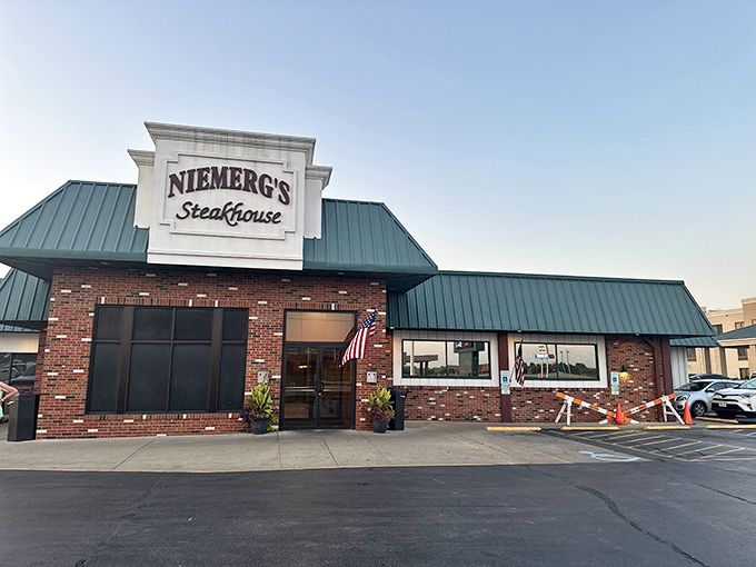 Welcome to beef paradise! Niemerg's Steakhouse stands proud, its green roof a beacon for hungry travelers and locals alike.