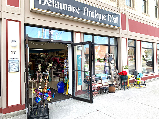 Step right up to the time-travel emporium! The Delaware Antique Mall's facade promises a journey through decades, with colorful flowers hinting at the treasures within.