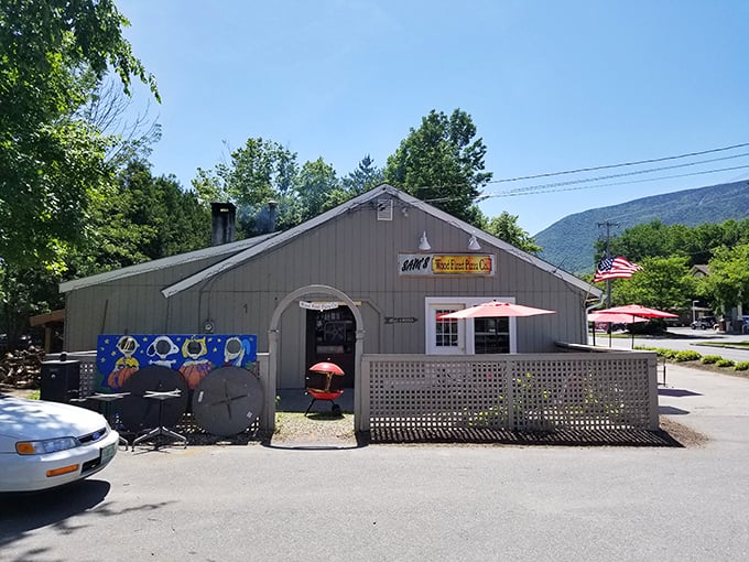 Welcome to pizza paradise! Sam's Wood Fired Pizza stands proud against the Vermont sky, promising delicious adventures within its humble walls.