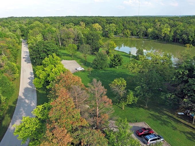 A bird's-eye view of paradise! Ouabache State Park unfolds like nature's own patchwork quilt, with lush forests, winding roads, and a shimmering lake.
