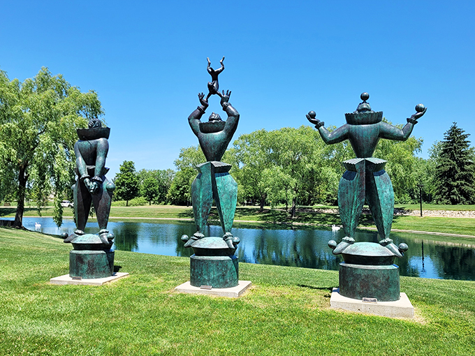 Cosmic jugglers or avant-garde yoga? These whimsical figures by the lake prove art can be both puzzling and delightful. A perfect spot for contemplation or impromptu dance parties.