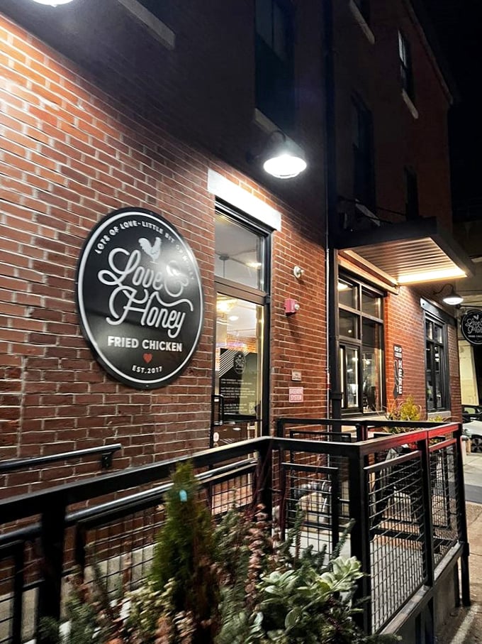 A beacon of crispy goodness in the night! Love & Honey's storefront promises a fried chicken adventure that'll make your taste buds do a happy dance.