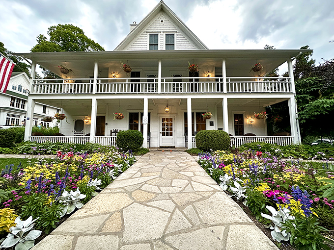 A postcard-perfect welcome: The White Gull Inn's charming facade and vibrant flower beds invite you to step into a world where relaxation reigns supreme.