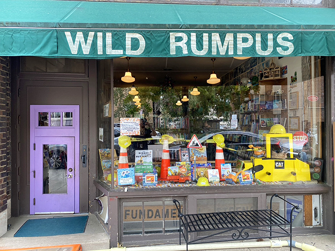Welcome to Wild Rumpus, where books and adventure collide! This whimsical storefront, complete with a child-sized purple door, promises literary delights for all ages.
