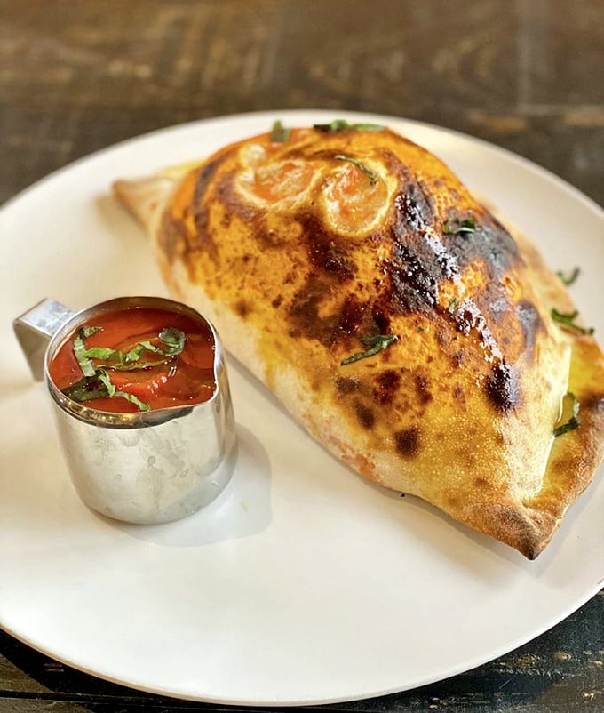 Is it a calzone or edible art? Either way, this golden pocket of joy is begging to be devoured.