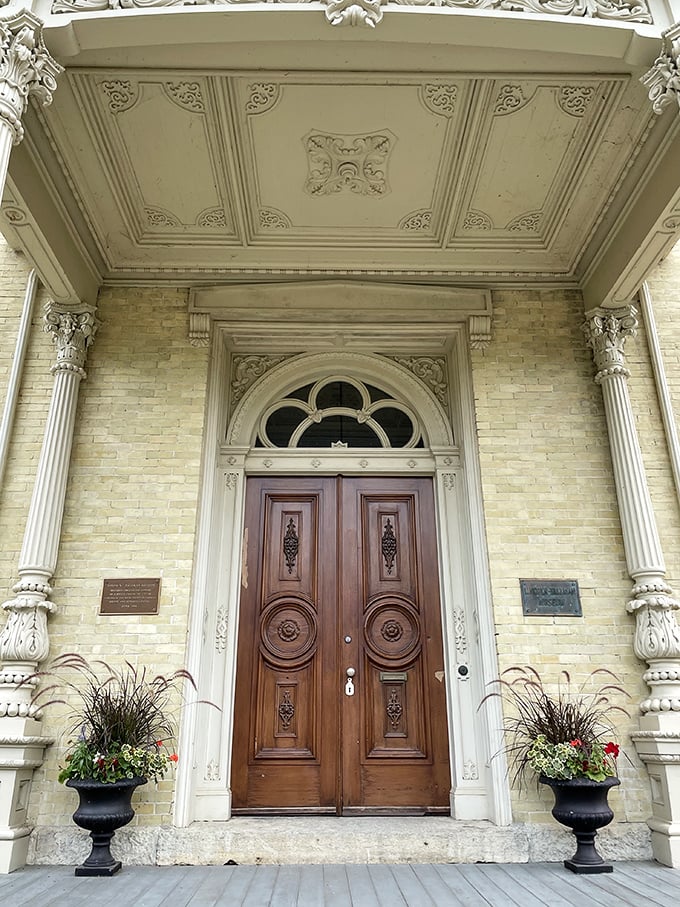 Knock knock! Who's there? 1857, and it's brought some seriously swanky woodwork. This door's got more curves than a country road.