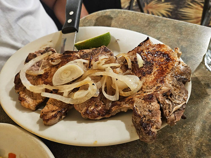 Grilled pork chops that could make a vegetarian weep. Juicy, tender, and packed with flavor - it's pork perfection on a plate.