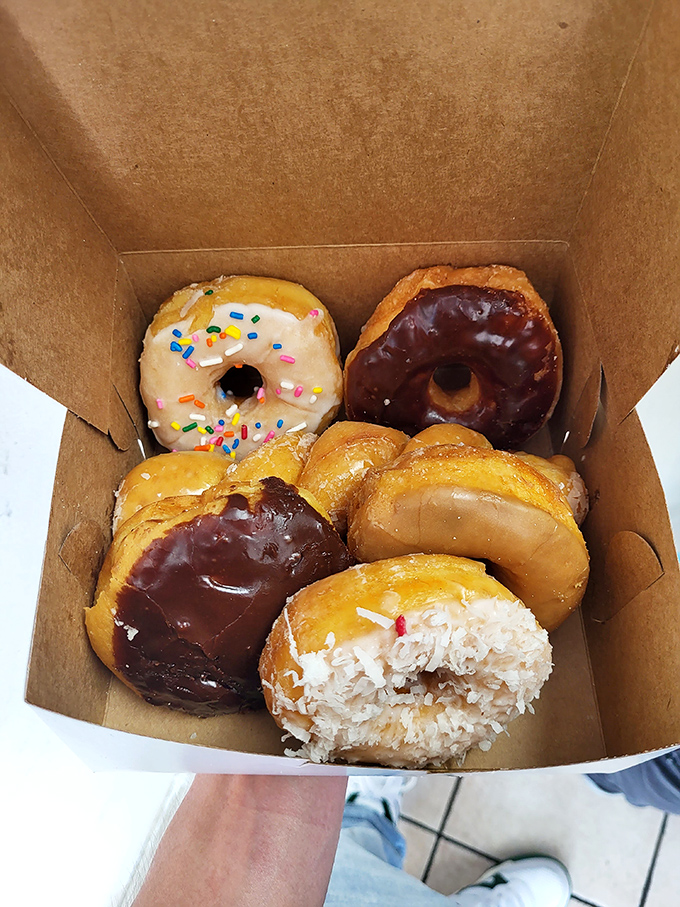 A half-dozen slice of heaven! This box of assorted donuts is like a greatest hits album for your mouth, each one a chart-topping flavor.