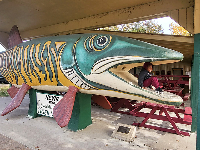 Who needs a photo booth when you've got a fish booth? This gal's smile is infectious &ndash; must be something in the water!