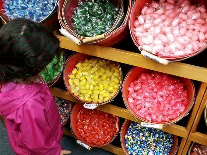 The face of pure concentration. Choosing your perfect candy mix is serious business when you're knee-high to a gumball machine.