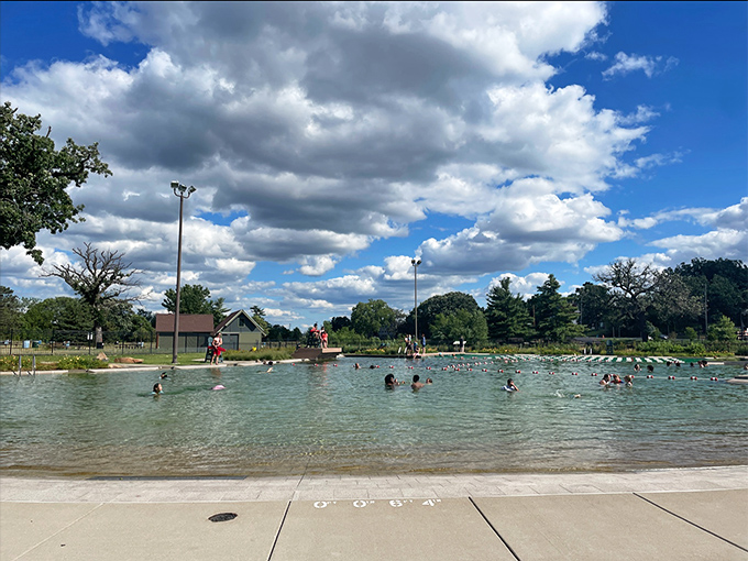 Splash central! This poolside view captures the essence of summer fun &ndash; crystal clear water, happy swimmers, and that unmistakable sound of joy.