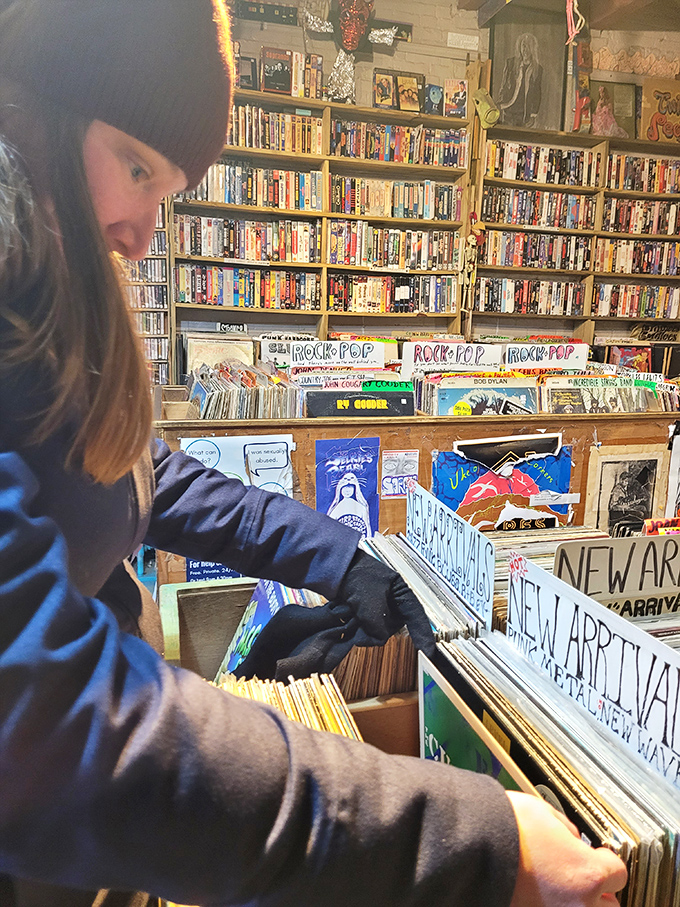 Treasure hunter in action! Watch as this intrepid explorer navigates the vinyl jungle in search of the perfect beat.