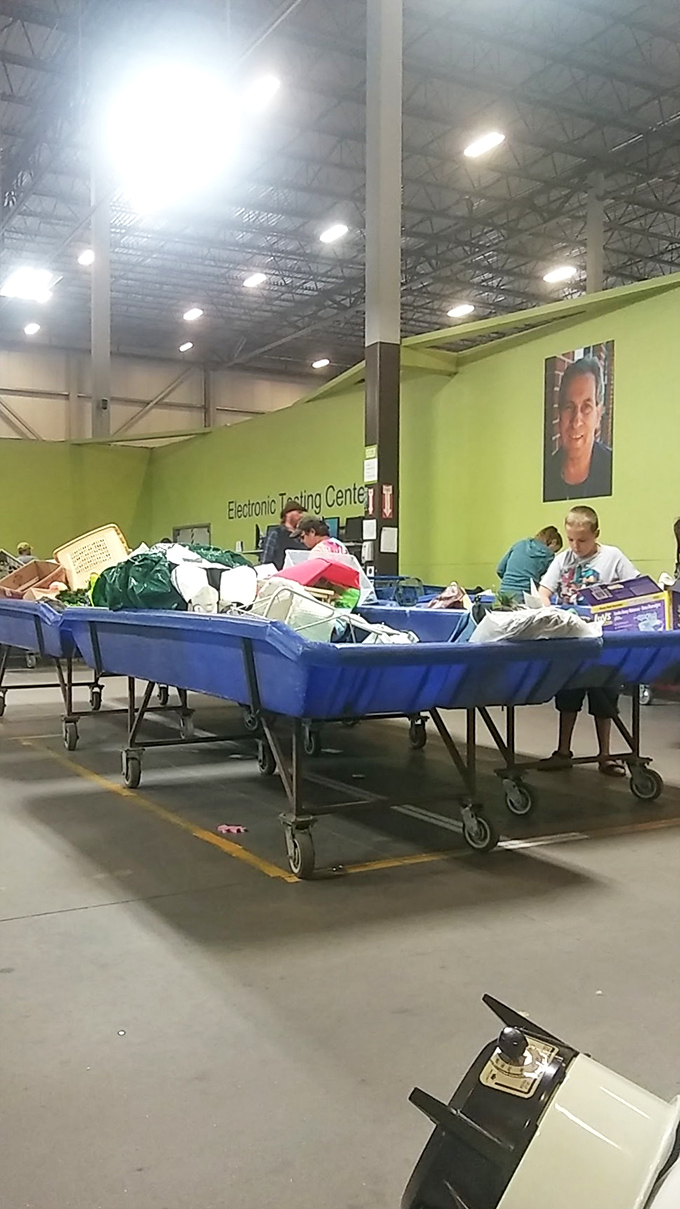 Treasure hunters in their natural habitat: Watch as they navigate the sea of blue bins with laser focus and nimble fingers.