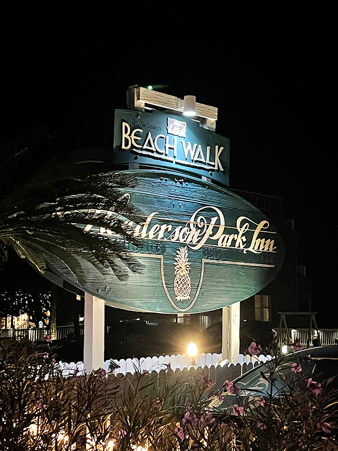 The Beach Walk sign: your beacon to culinary bliss. It's like a lighthouse, but instead of ships, it guides hungry souls.