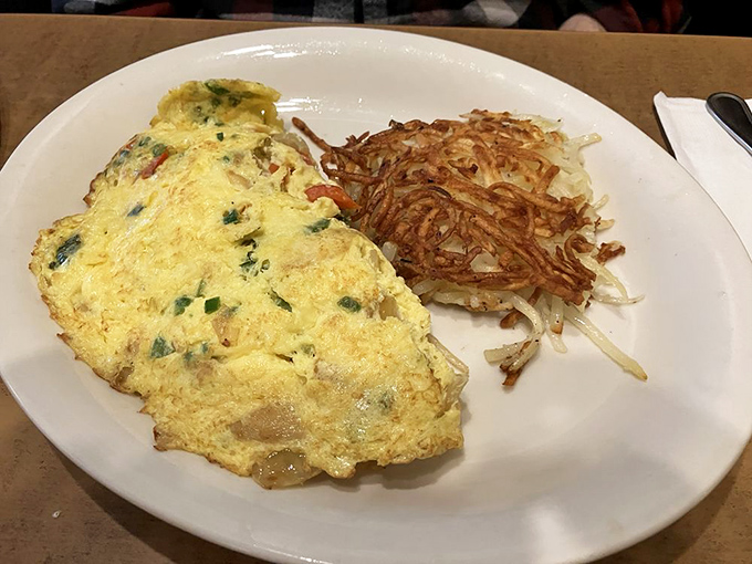 This veggie omelet is so fresh, it might start a conversation about photosynthesis. A garden party wrapped in eggy perfection.