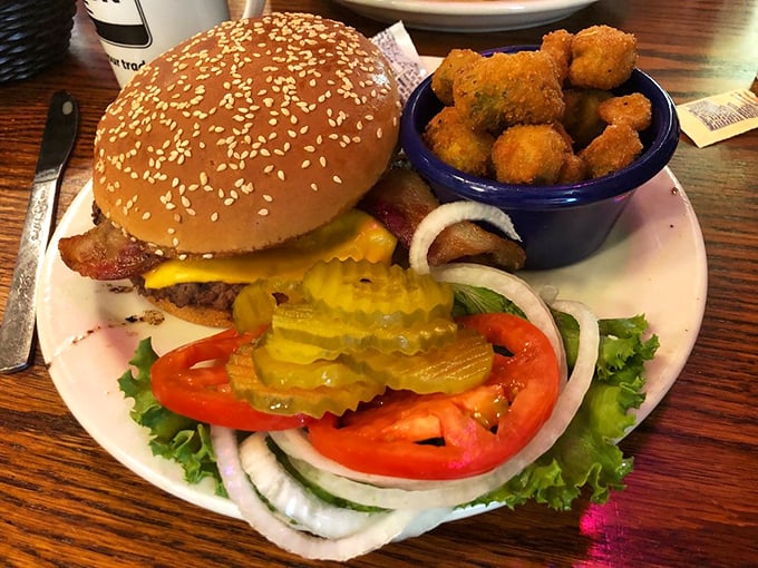 This isn't just a burger&mdash;it's a tower of temptation! Stacked high with all the fixings, it's a challenge your taste buds will gladly accept.