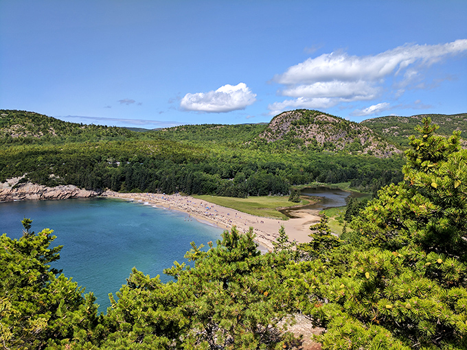 A beach with a view that'll make your vacation photos look like you've mastered Photoshop. No filter needed when Mother Nature's the artist.