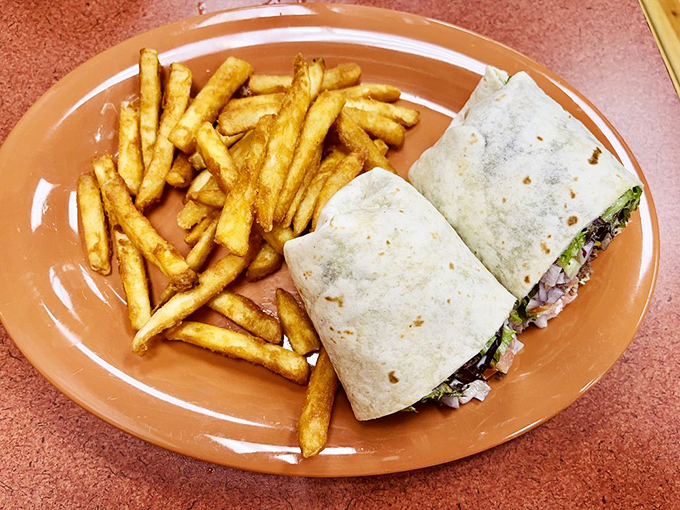 Wrap star! This hearty handheld proves that not all heroes wear capes &ndash; some come wrapped in tortillas with a side of crispy fries.