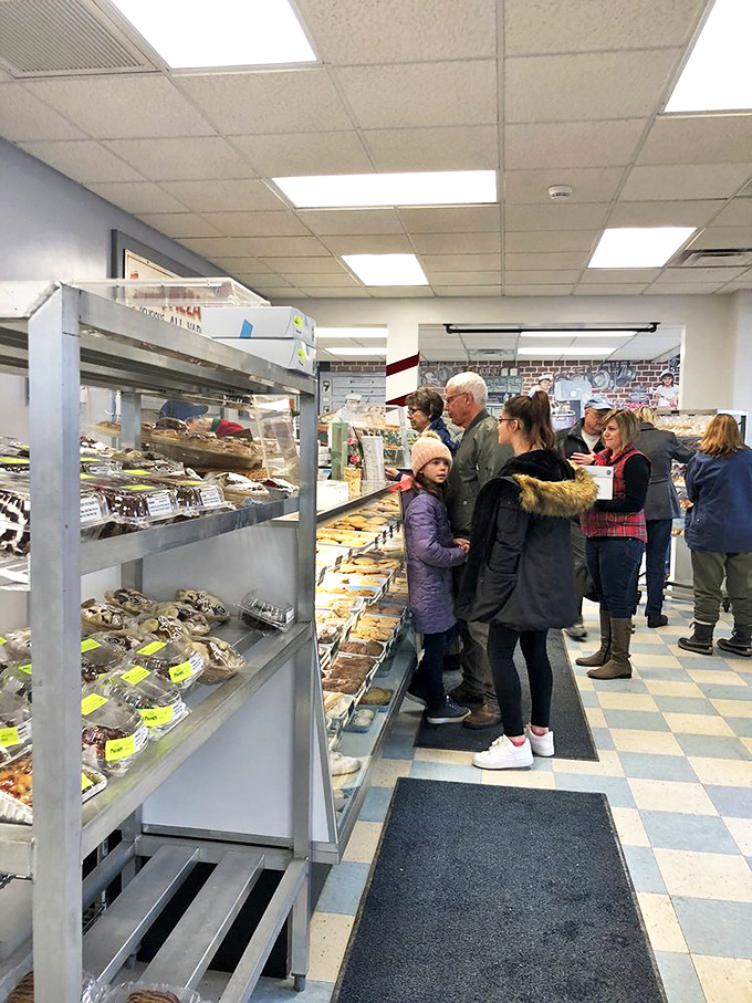 Feast your eyes on this bakery hustle and bustle. It's like watching a delicious ballet, with customers pirouetting from display to display.